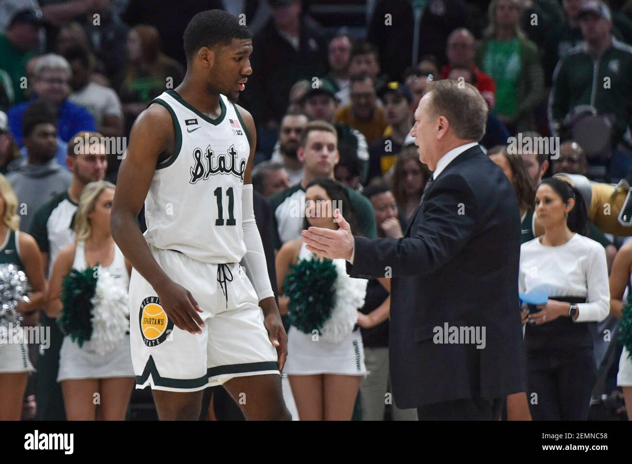 Aaron Henry of the Michigan State Spartans talks with Head Coach Tom ...