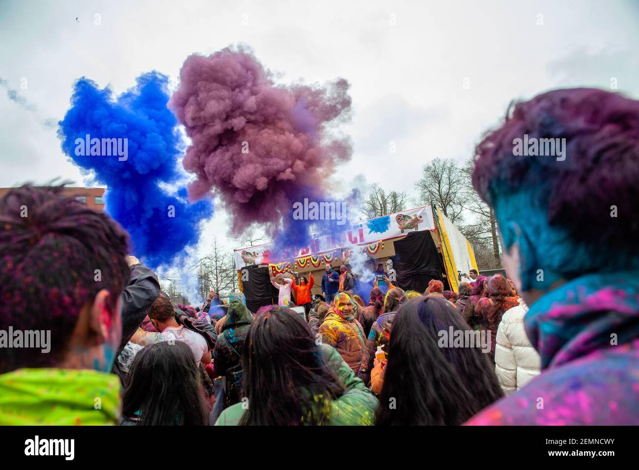 Canons are seen throwing colored powders during the celebration ...