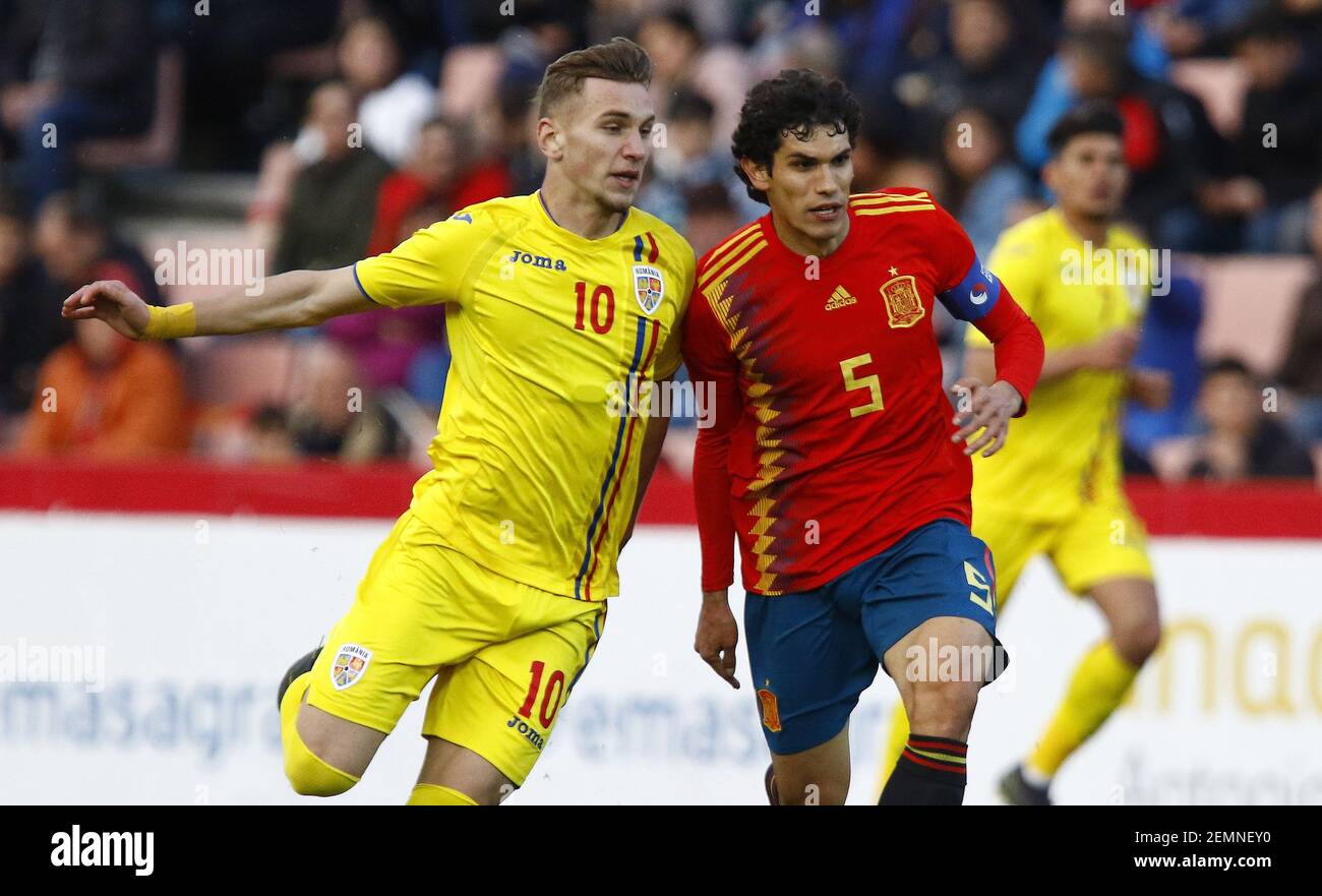 Romania's Dragus Denis and Spain's Jesus Vallejo during the ...