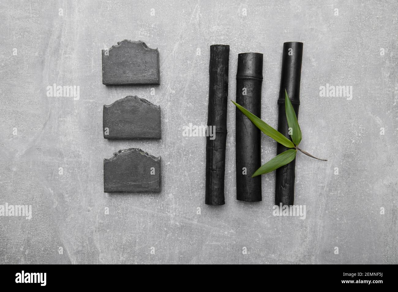 Black bamboo charcoal and black soap bars with bamboo charcoal on grey ...
