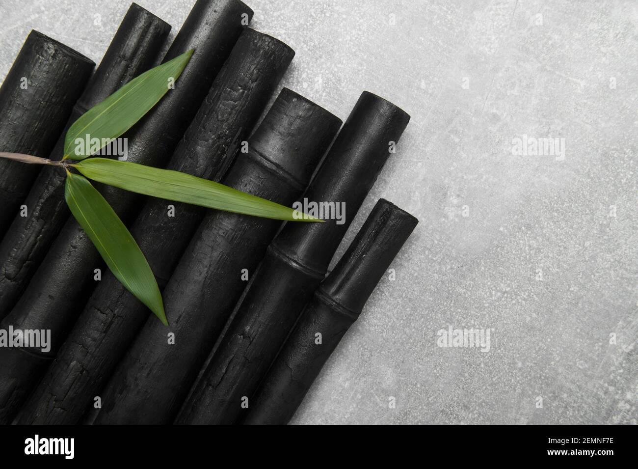 Natural activated bamboo charcoal on concrete background. Realistic ...