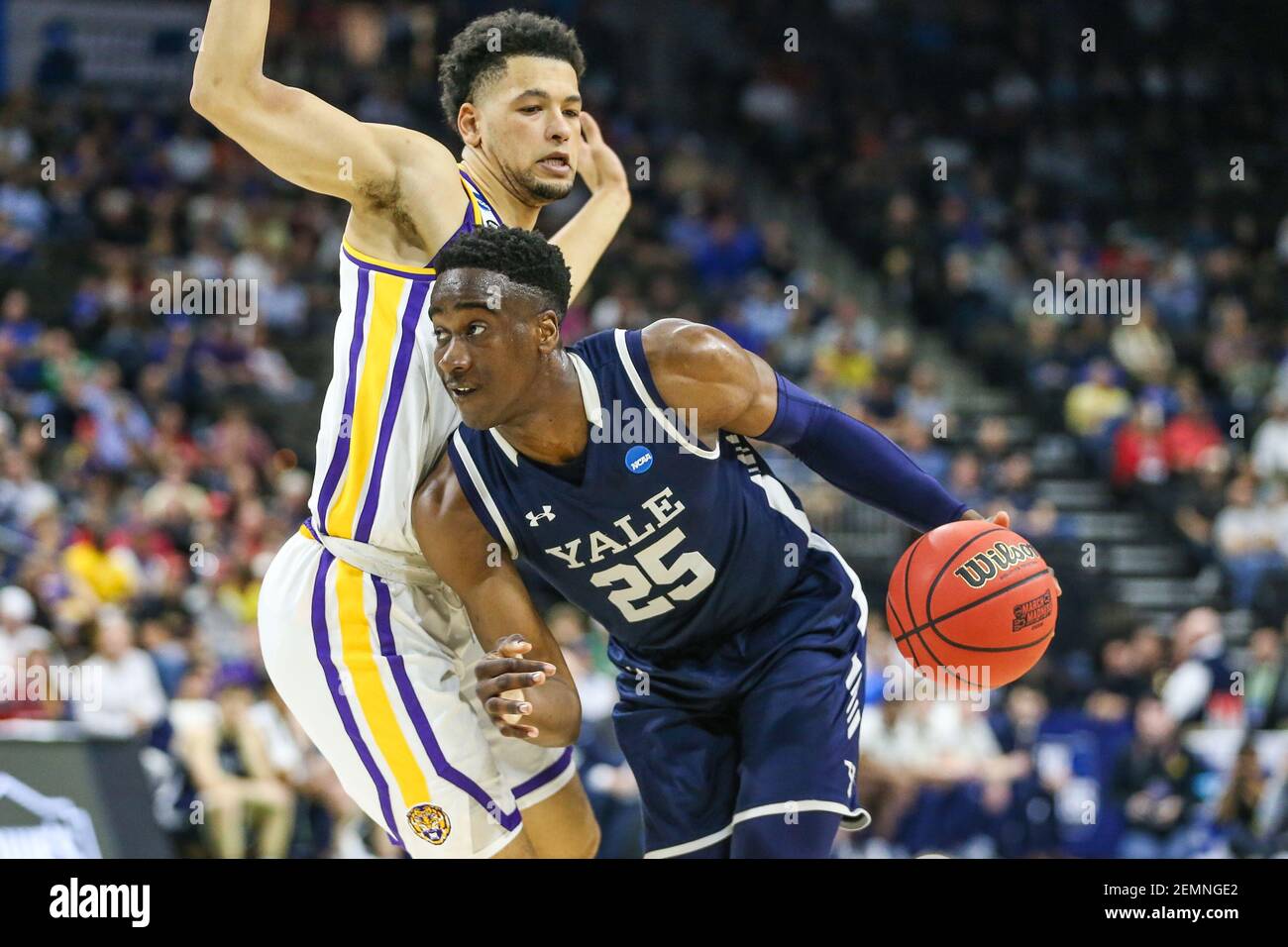 Yale Bulldogs guard Miye Oni (25) drives the ball past LSU Tigers guard ...
