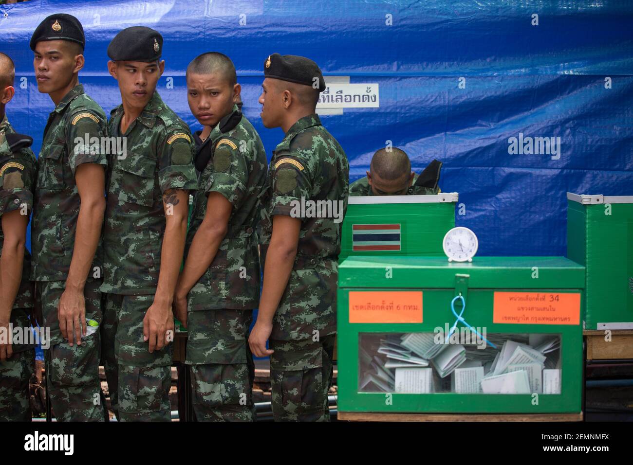 Thai soldiers queue up at a polling station near Victory Monument in ...