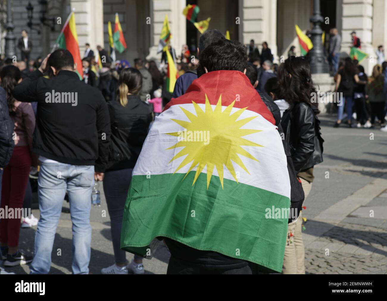 (3/23/2019) A Kurd wears the Kurdish flag over his shoulders. Several ...