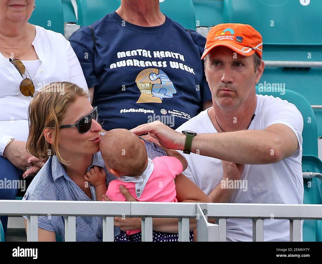 Parents try to quiet their crying baby as Venus Williams prepares to ...