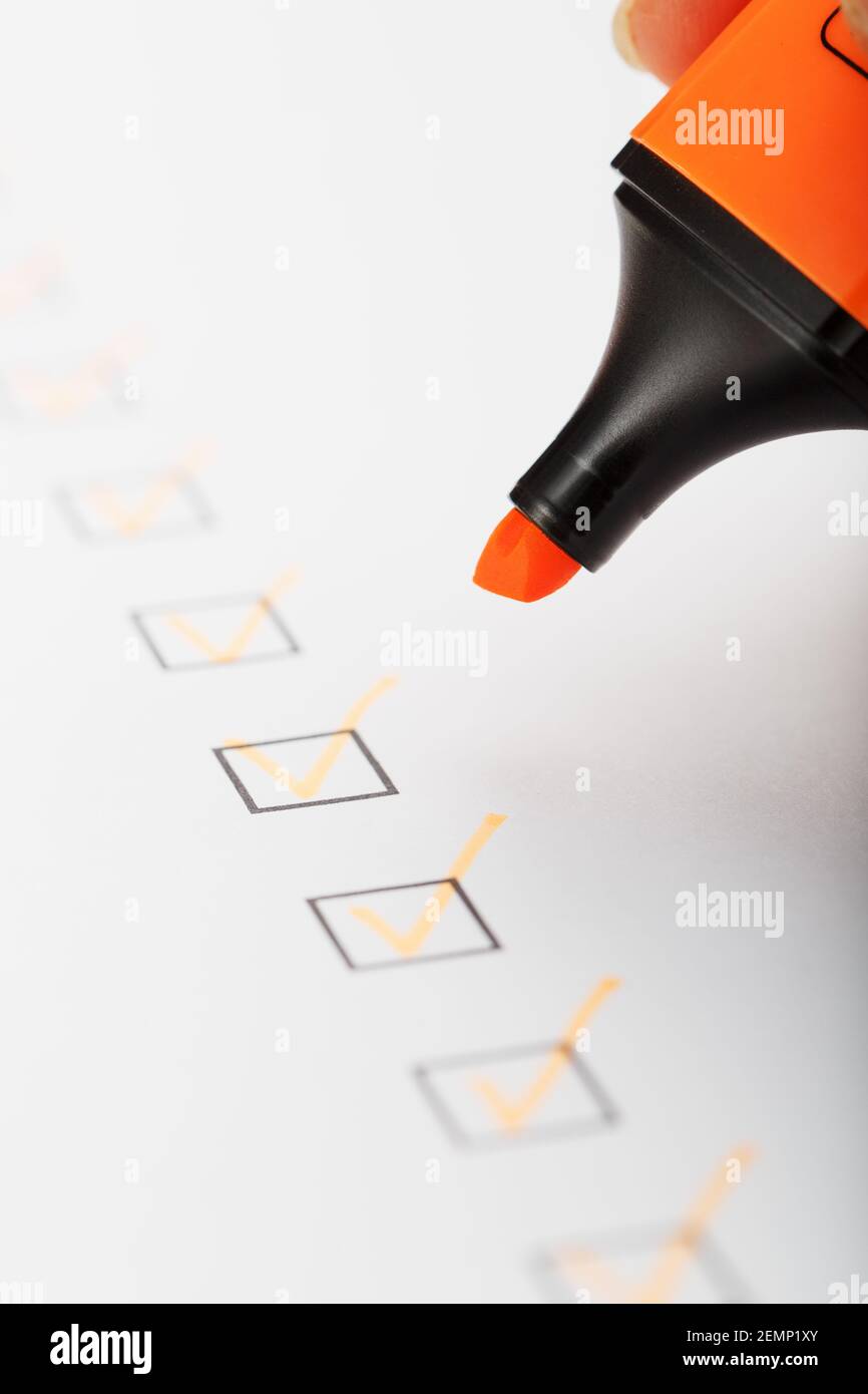 Orange marker with markers on the checklist sheet. Checklist completed ...
