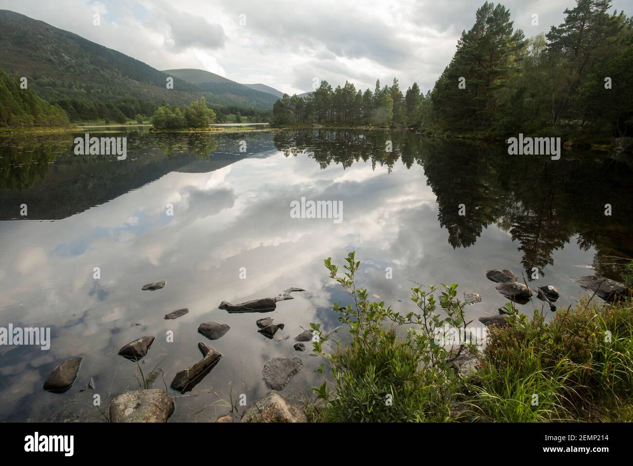 reflections on a loch in Scotland Stock Photo - Alamy