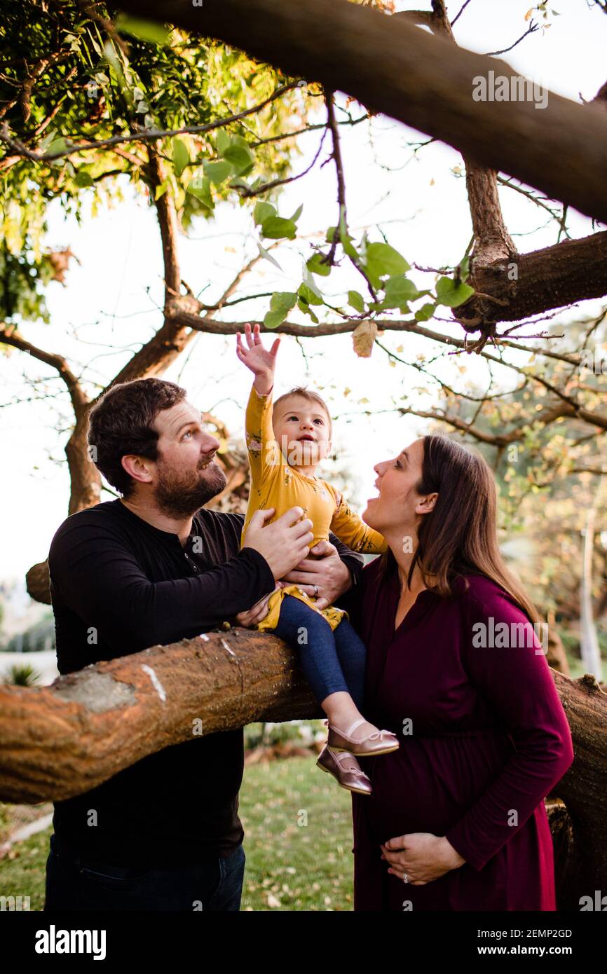 Exciting Parents Looking at Daughter in San Diego Stock Photo - Alamy