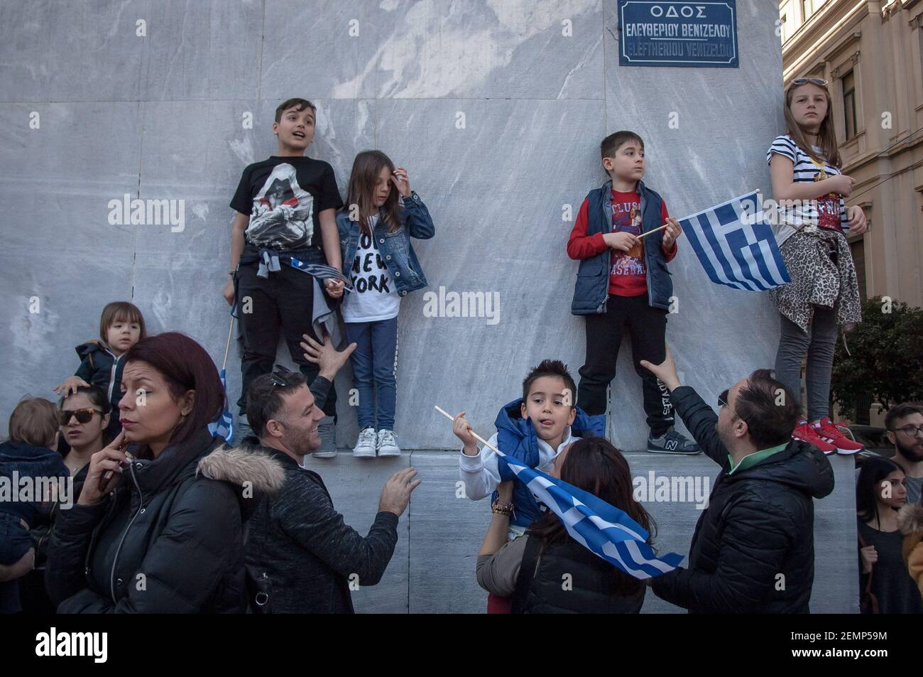 Kids seen holding Greek flags during the celebration. Military parades ...