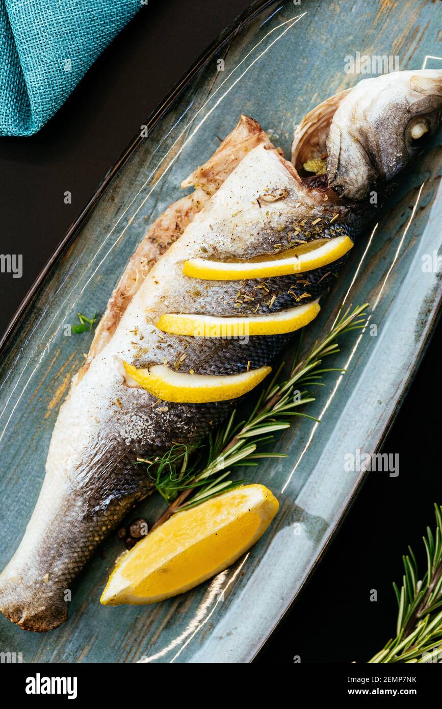 grilled fish with herbs and lemon Stock Photo - Alamy