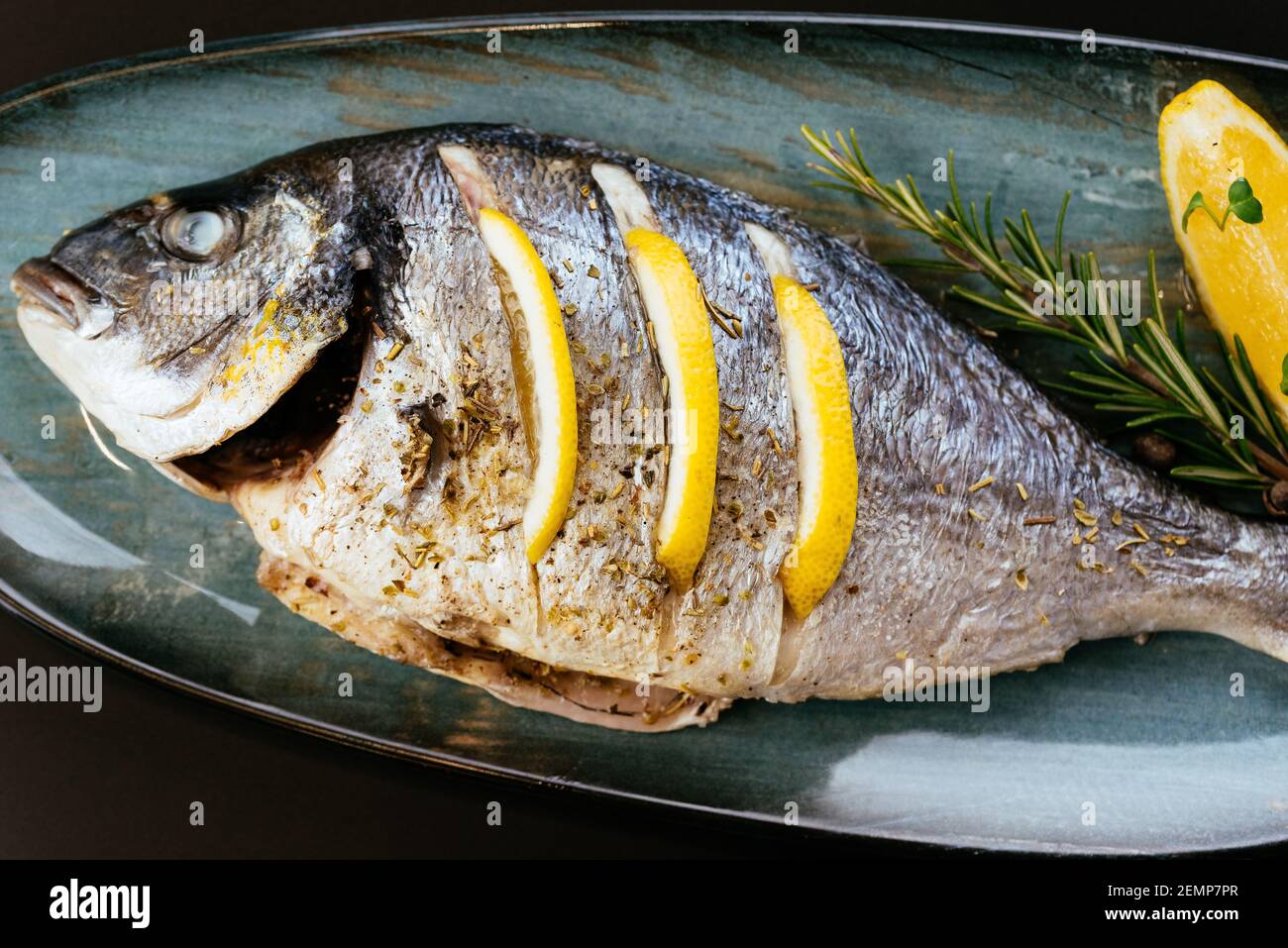 grilled fish with herbs and lemon Stock Photo - Alamy