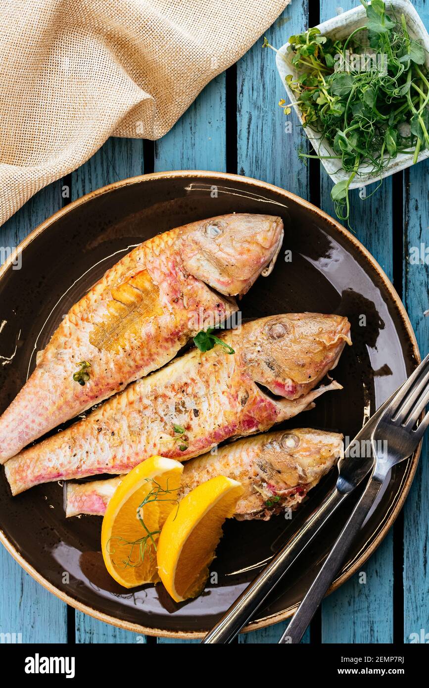 grilled fish with herbs and lemon Stock Photo - Alamy