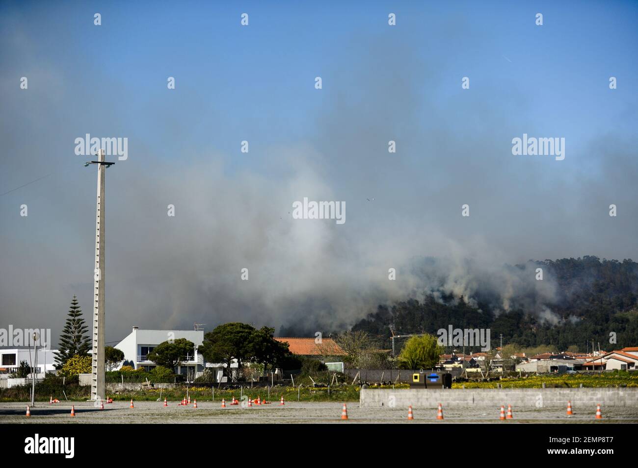 Smoke seen coming from a burning forest due to a wildfire that resulted ...