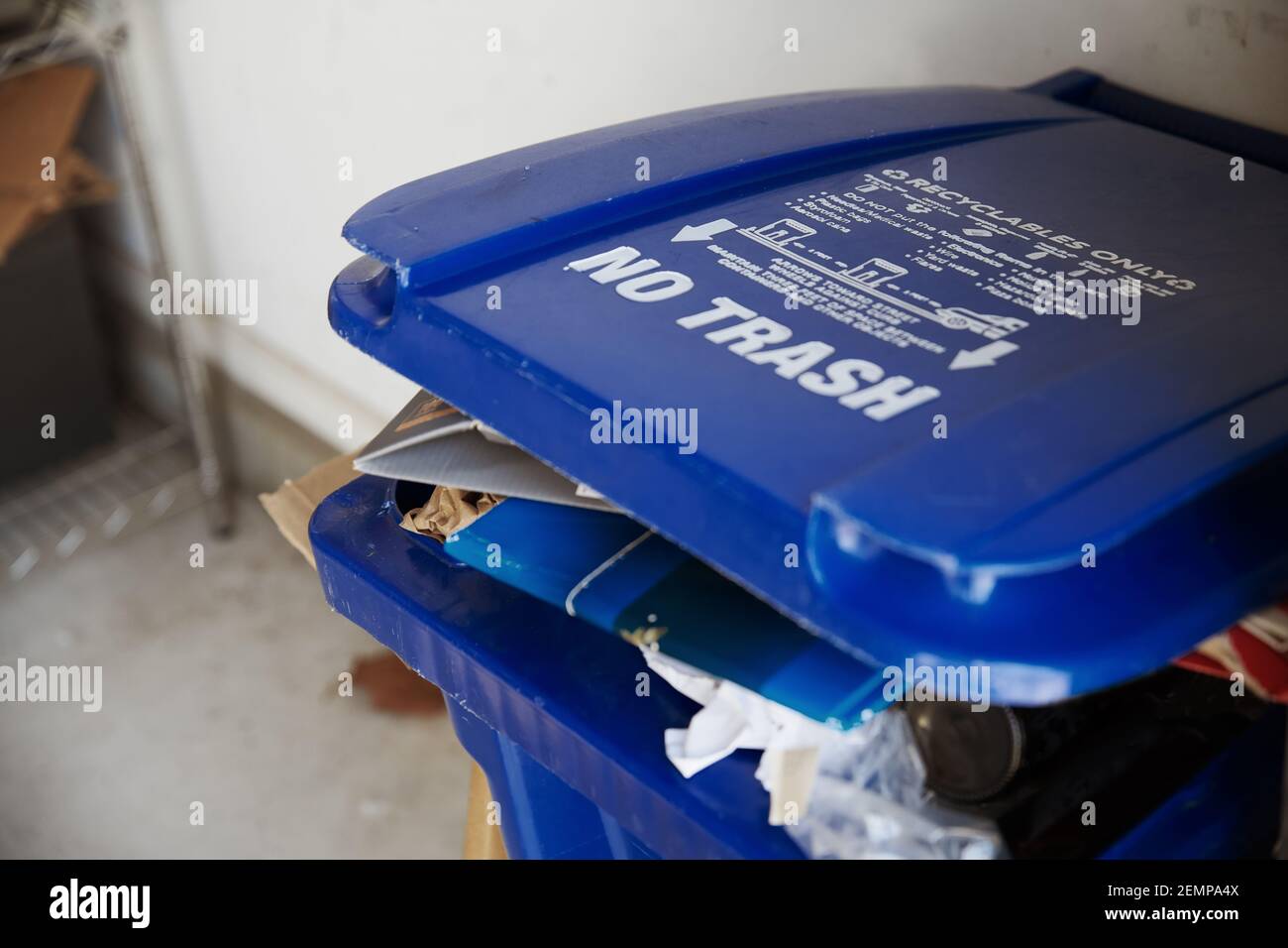 Recycling bin full of garbage Stock Photo - Alamy