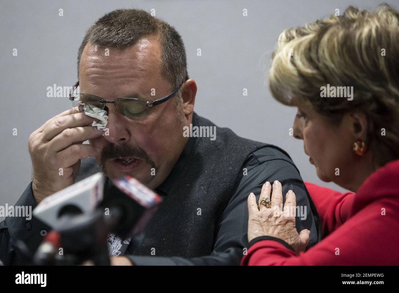 Lorry Borowski's brother, Mark Borowski, wipes away tears while ...