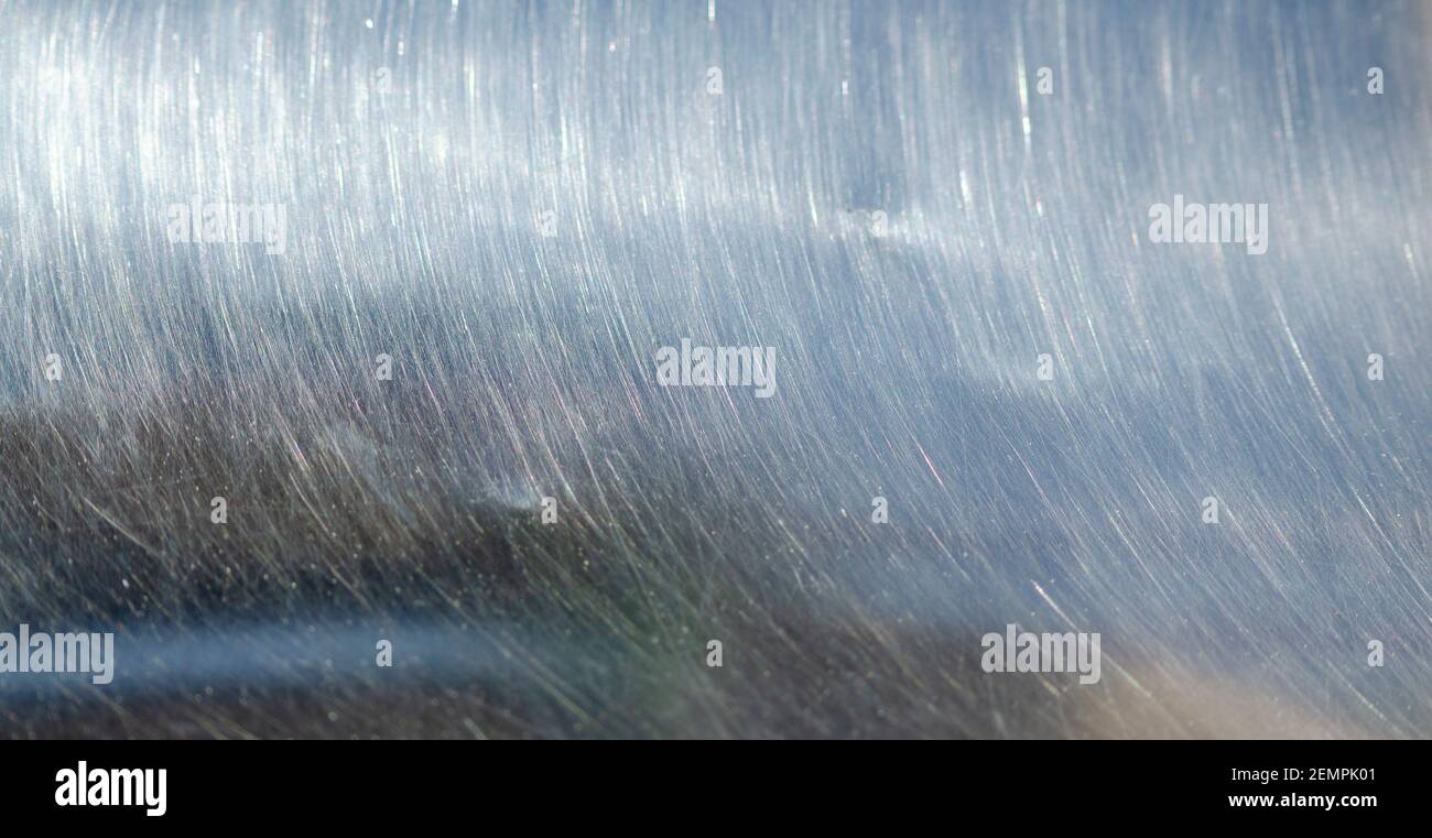 Scratched metal texture. The scratches are directed radially. Abstract ...