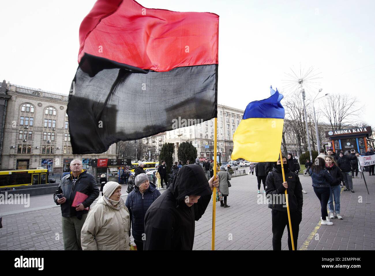 Youths are seen holding a Ukrainian flag and a Ukrainian Insurgent Army ...