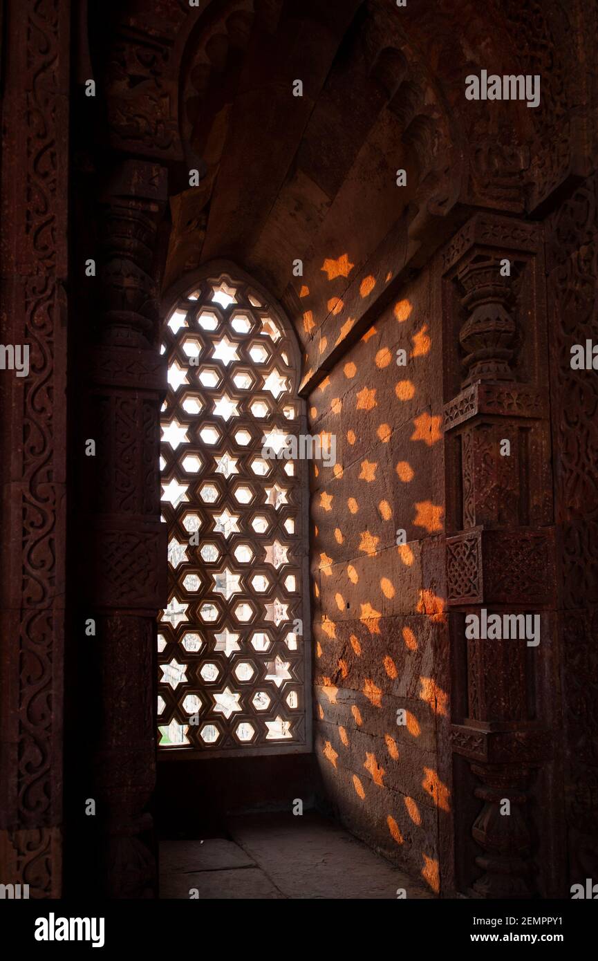 Sunlight shines through Mughal architecture window at Qutub Minar ...