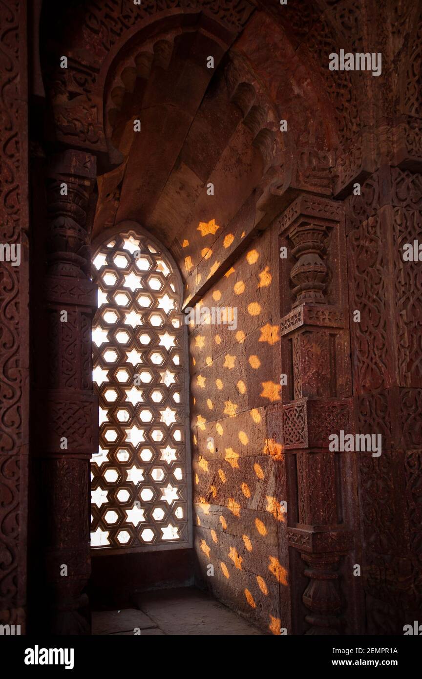Sunlight shines through Mughal architecture window at Qutub Minar ...