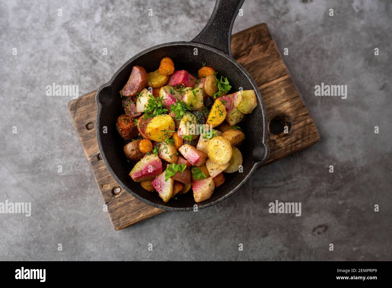 Roasted vegetables mix in a cast iron mini skillet ready to serve Stock ...