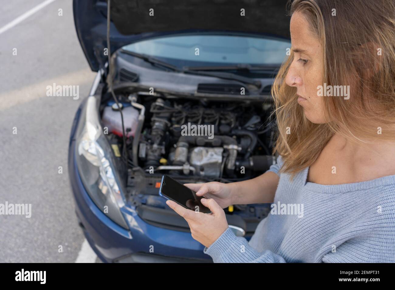 Call emergency assistance using hi-res stock photography and images - Alamy