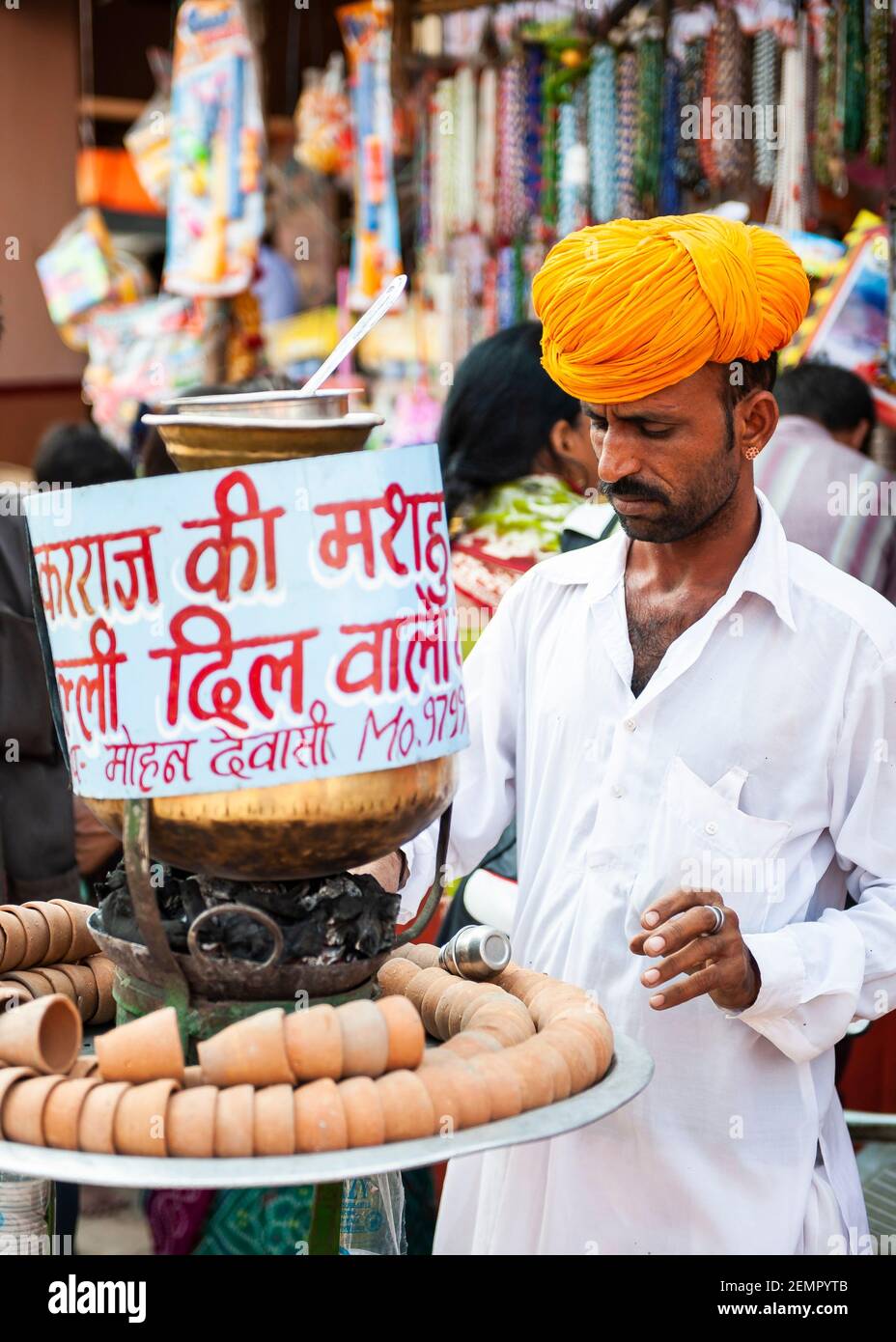 An Indian man prepares chai at his stall in Pushkar, India Stock Photo ...