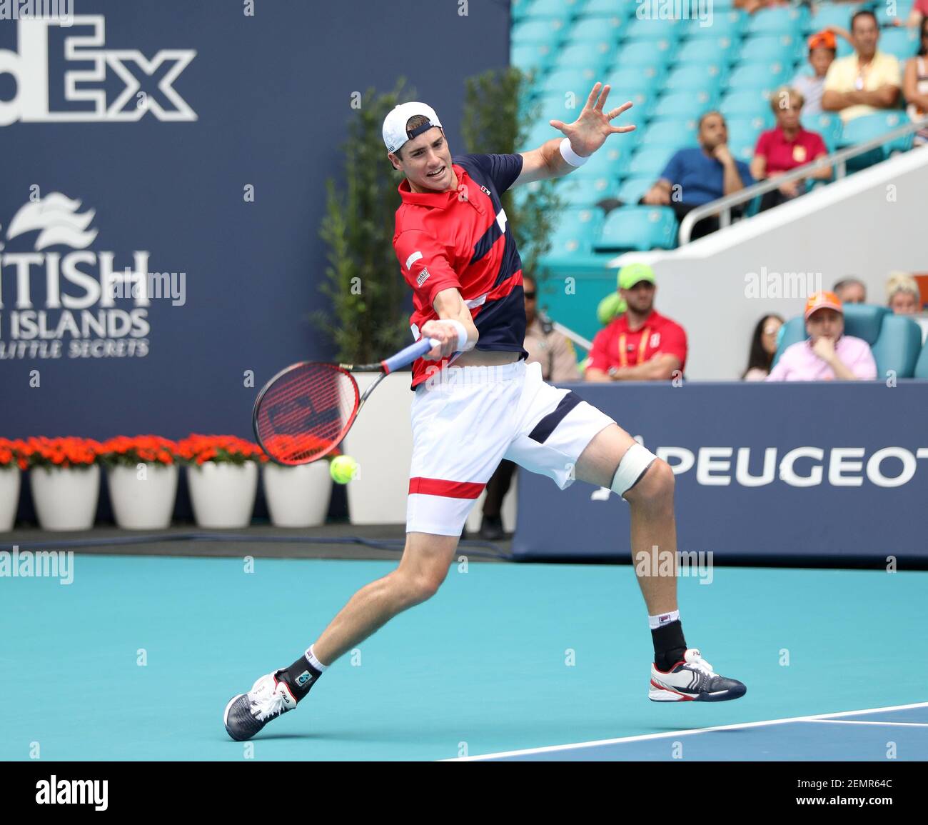 MIAMI GARDENS, FLORIDA - MARCH 31: John Isner plays Roger Federer of ...