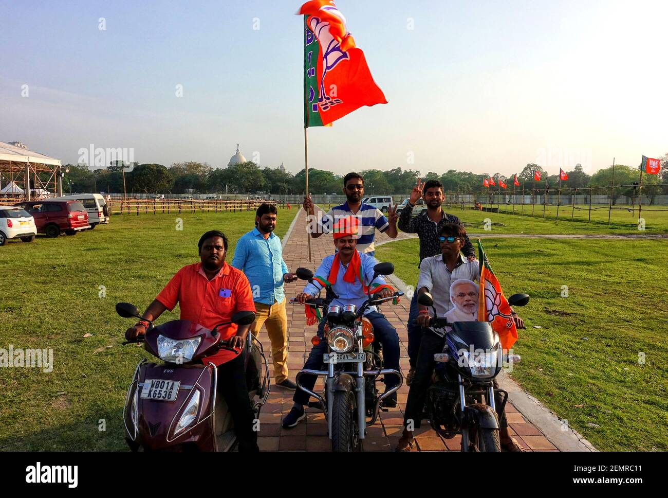 Bharatiya Janata Party supporters are seen showing victory sign before ...