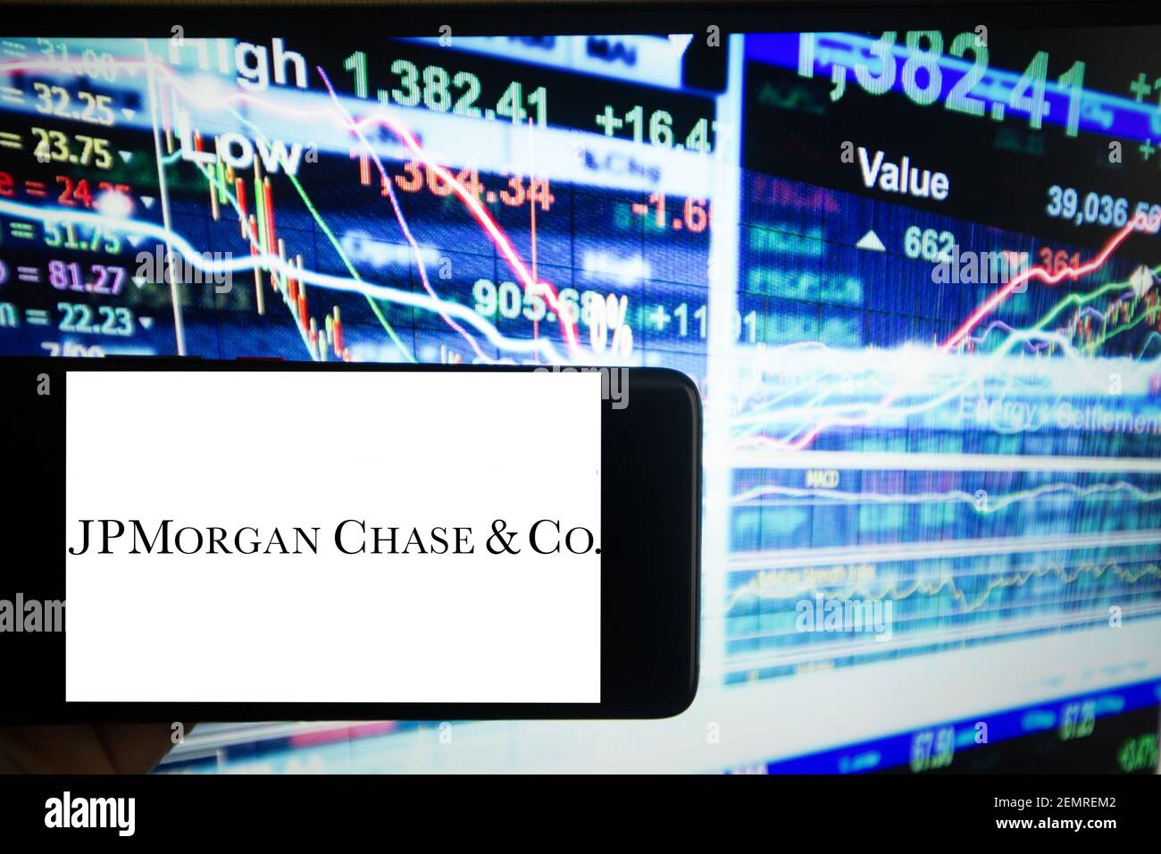The logo of JPMorgan Chase & Co. is seen on the screen of a smartphone ...