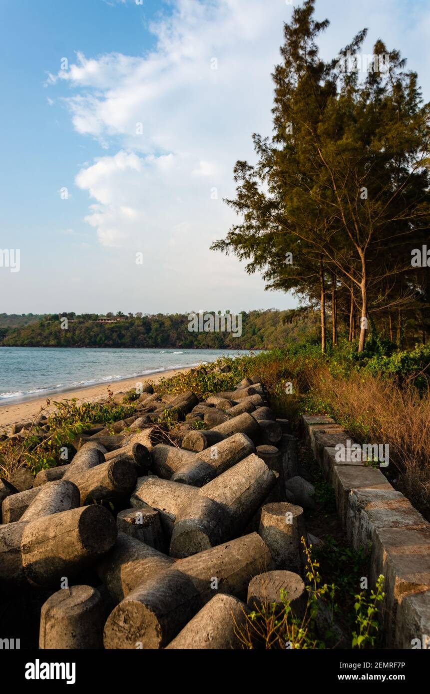 Querim Beach with tetra pods on the shore to prevent soil erosion. Querim or Keri Beach is ...