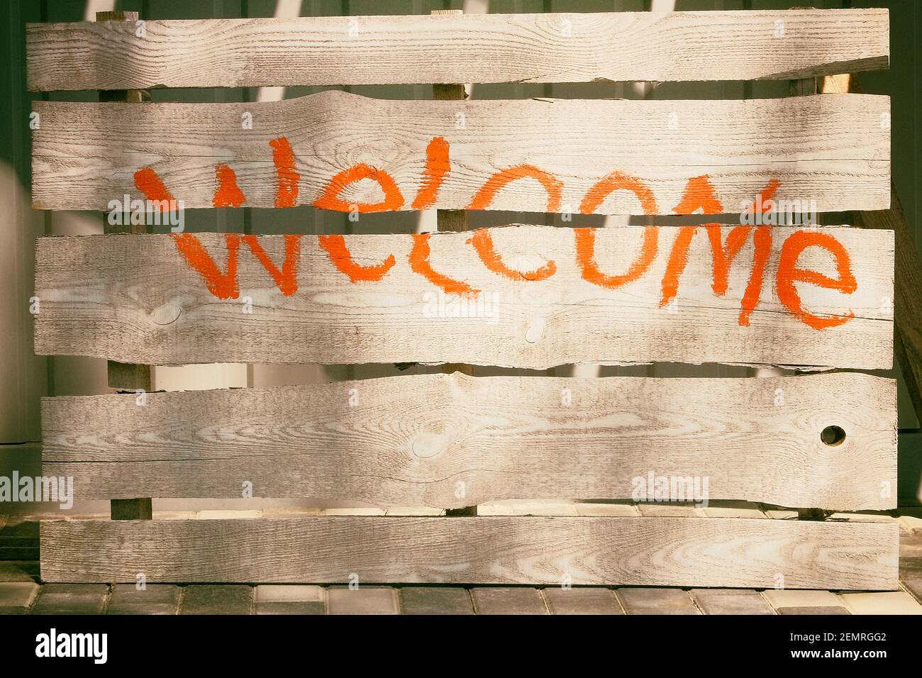 Welcome. Inscription on gray wooden board. Plank surface texture, board ...