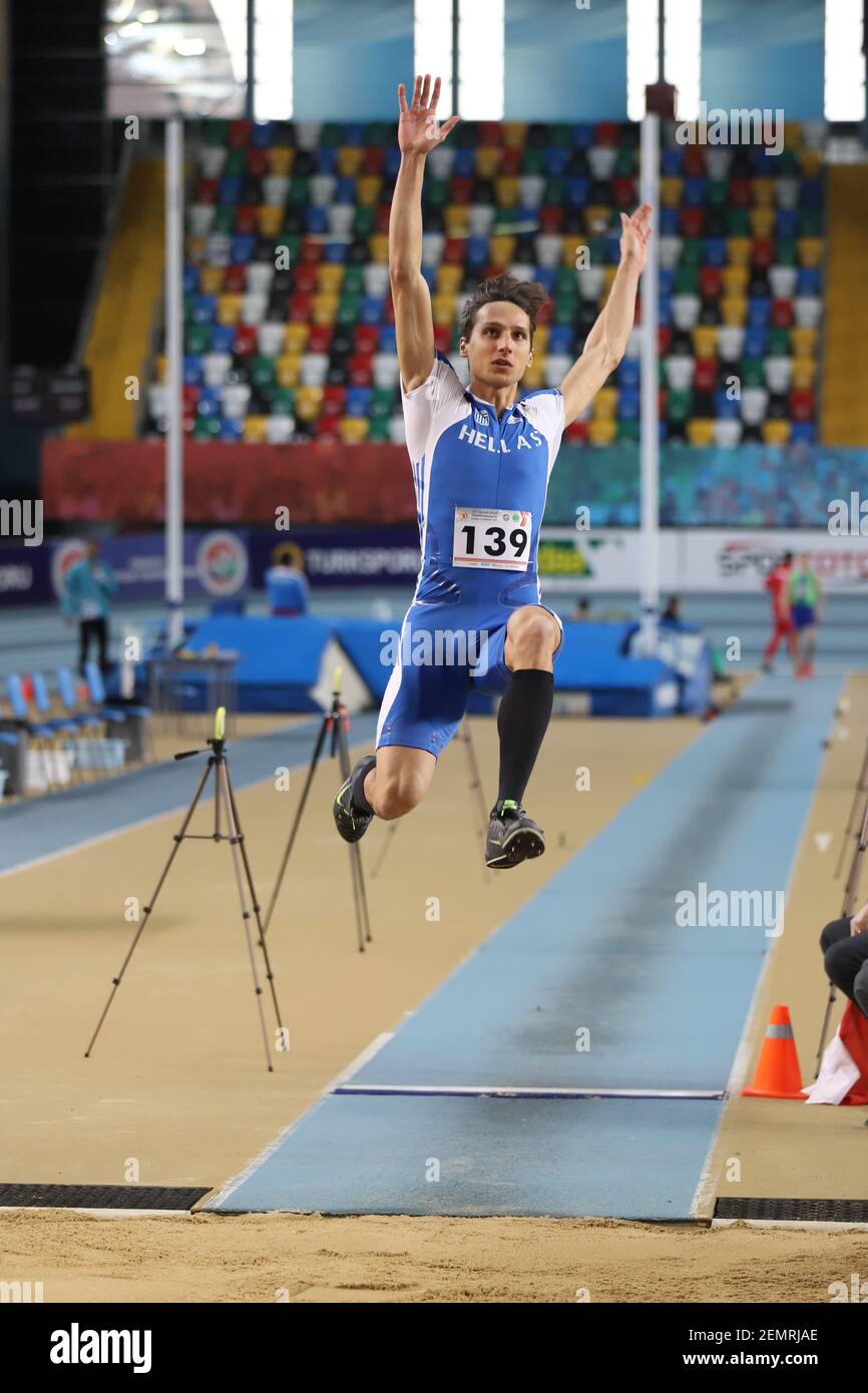 ISTANBUL, TURKEY - FEBRUARY 20, 2021: Undefined athlete long jumping ...