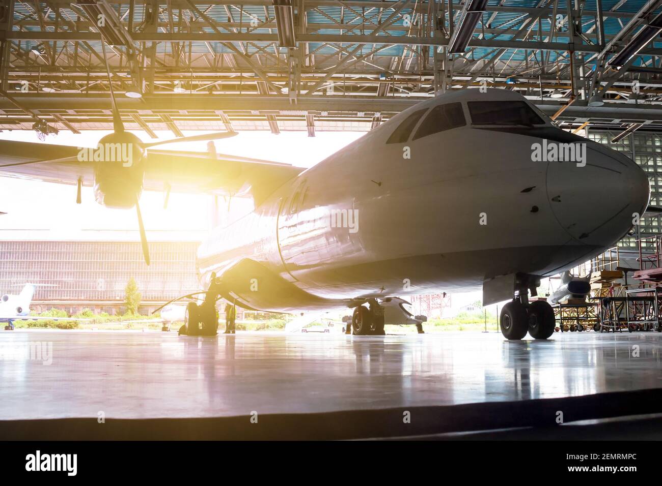 Repair of white passenger turboprop aircraft and checking mechanical ...