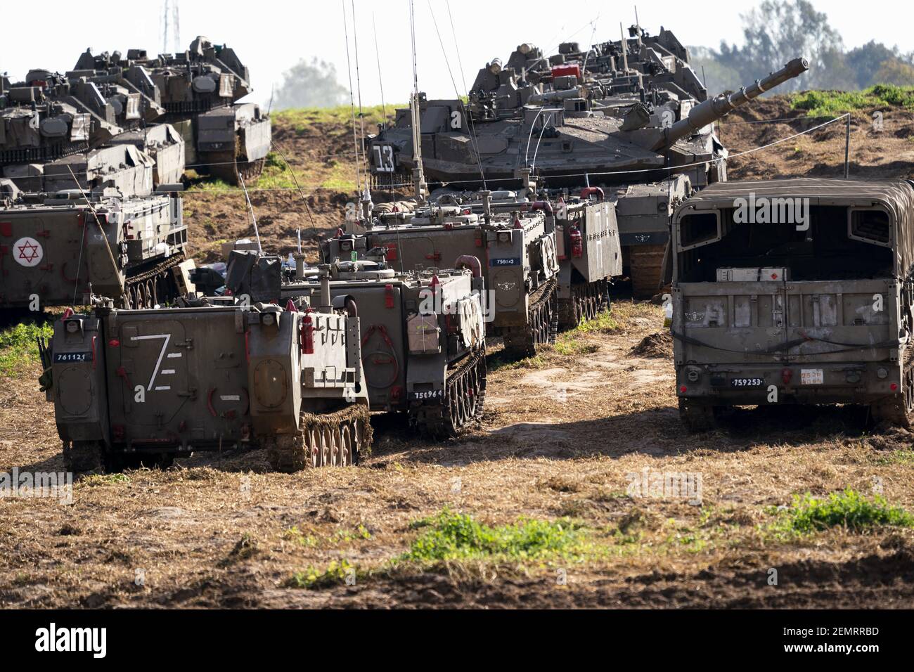 Israeli military vehicles and tanks positioned near the border with the ...