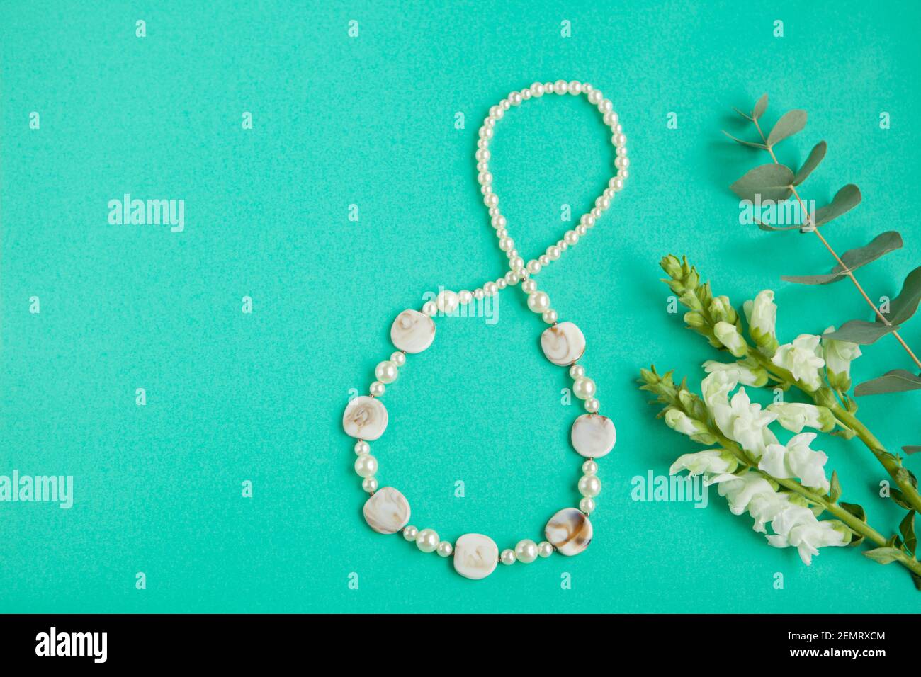 shape figure of eight 8 number on greenish paper background with white ...