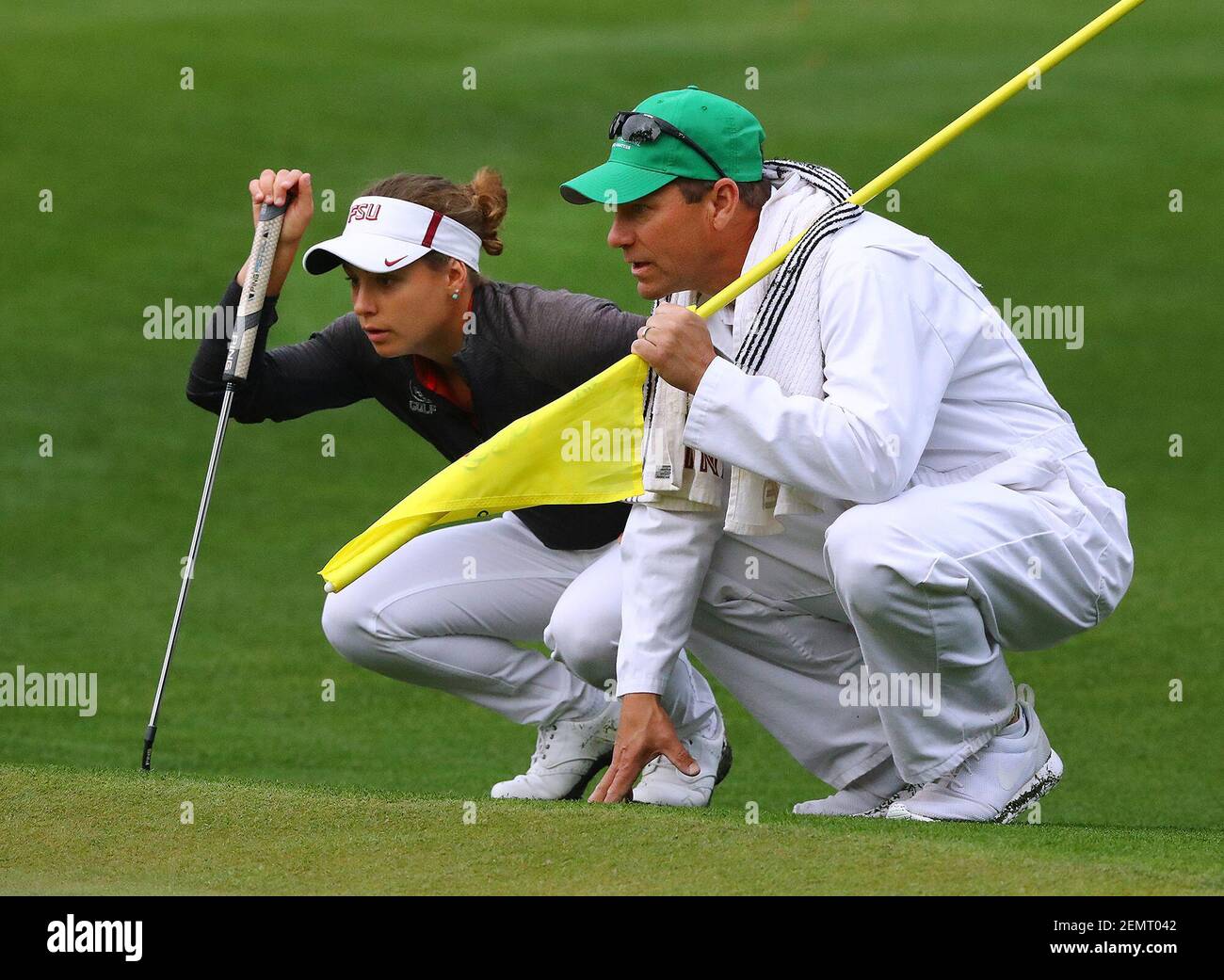 Amanda Doherty, Atlanta, and her dad Mike, serving as her caddy, line ...