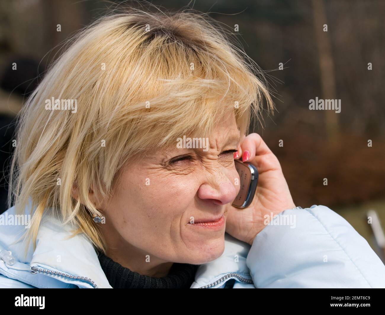 Mature lady having fun during making phone call Stock Photo - Alamy