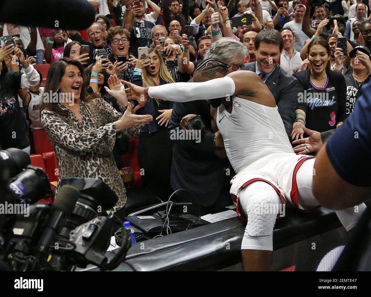 The Miami Heat's Dwyane Wade (3) slips on his way to the scorer's table ...