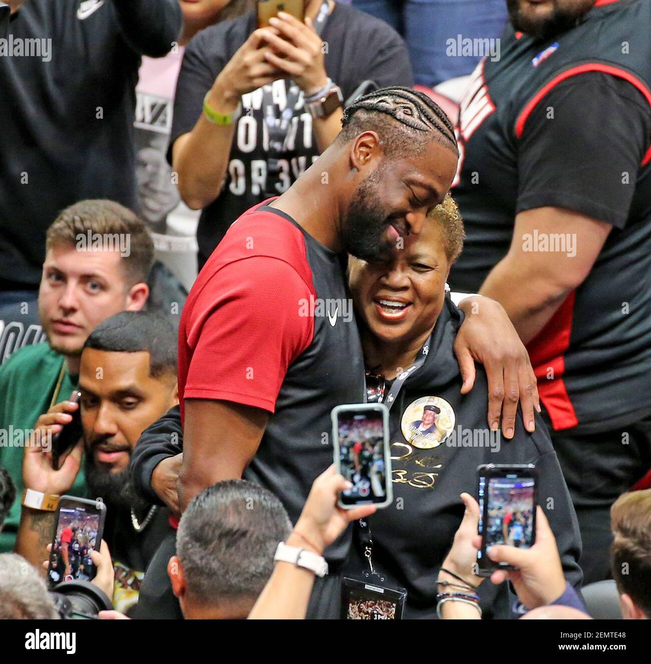The Miami Heat's Dwyane Wade hugs his mom, Jolinda, before his last ...