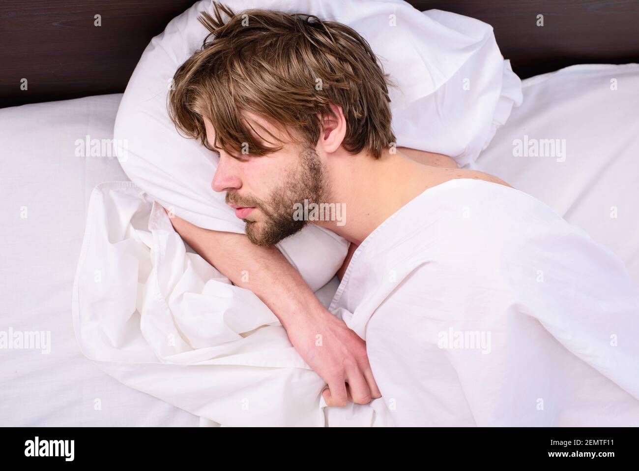 Man unshaven handsome relaxing bed. Power napping may help you get ...
