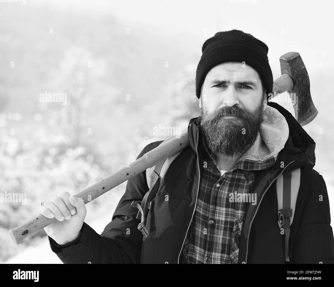 Hipster woodsman concept. Macho in winter clothes with backpack and ...