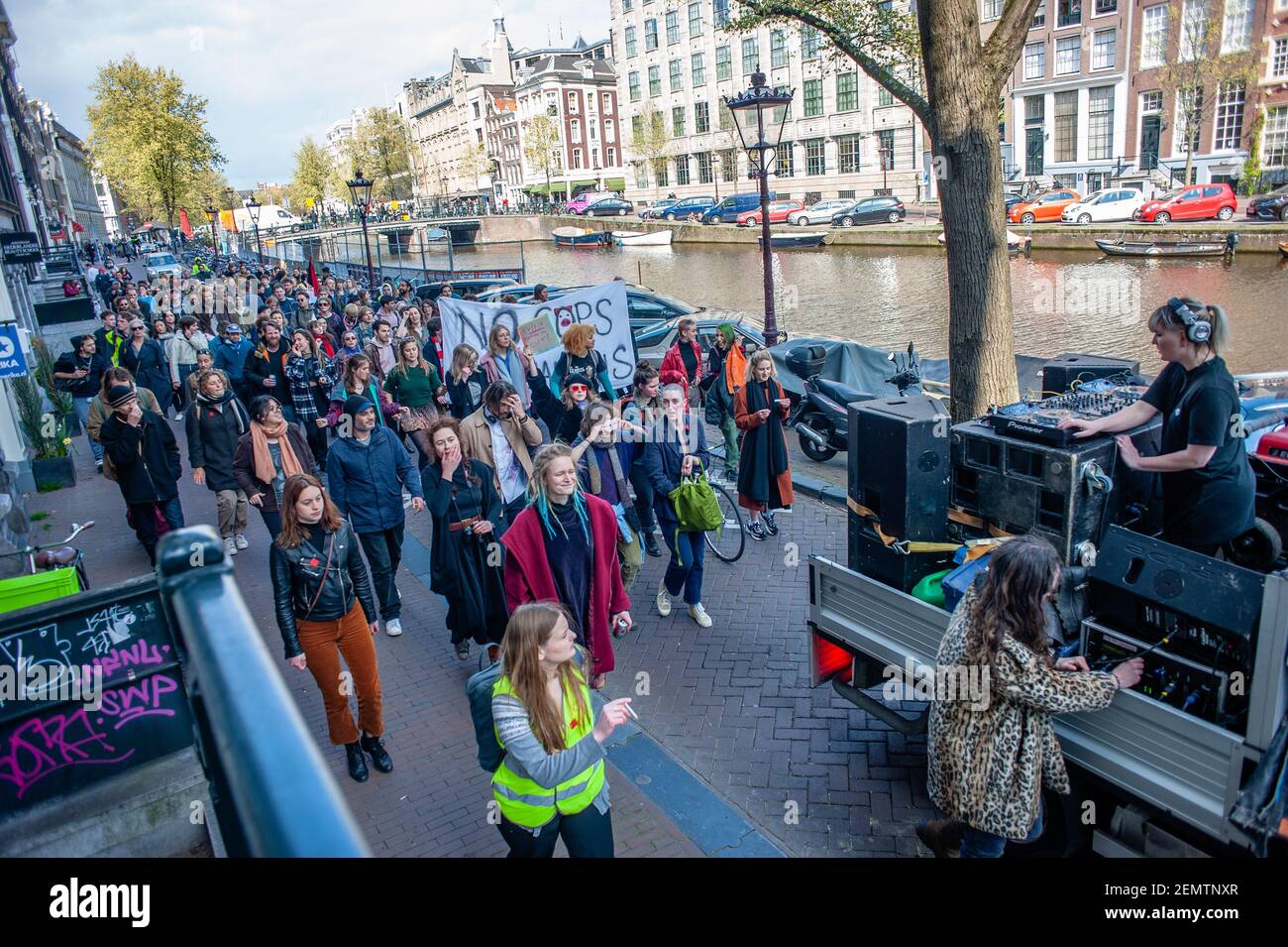 A group of students are seen dancing during the demonstration. Around ...