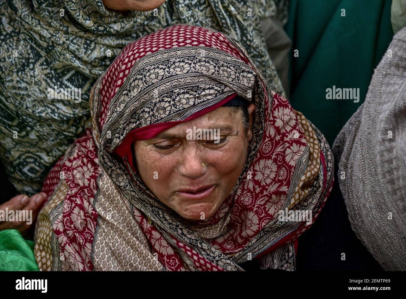 A devotee seen crying as a head priest displays a relic believed to be ...