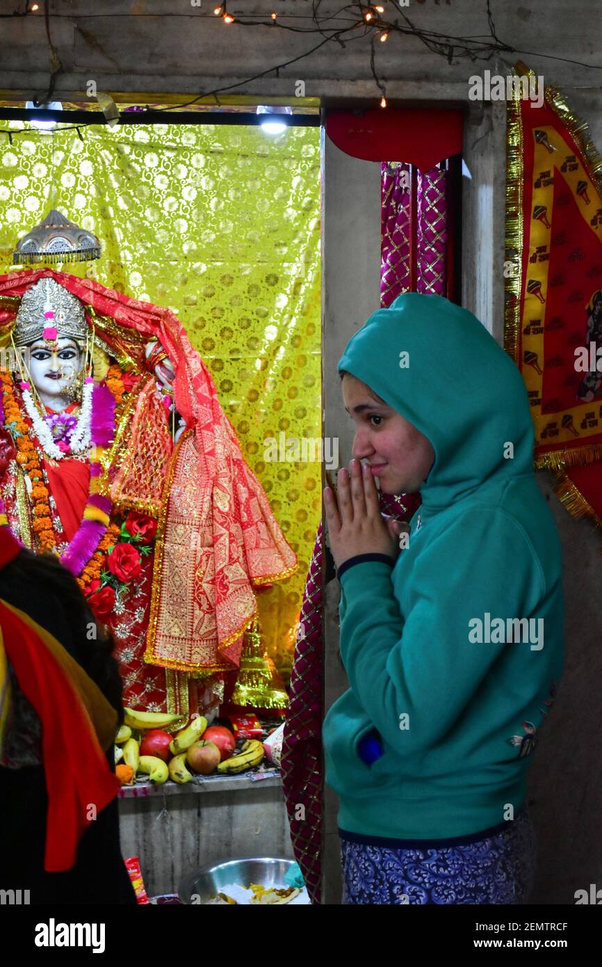 A devotee seen praying at a temple during the occasion. The festival of ...
