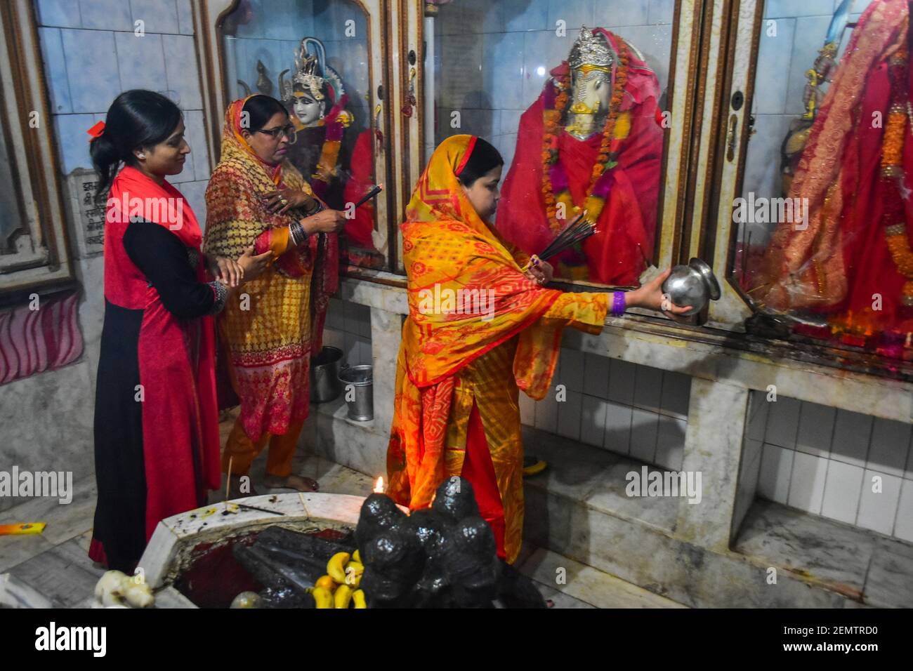 Devotees seen praying at a temple during the occasion. The festival of ...