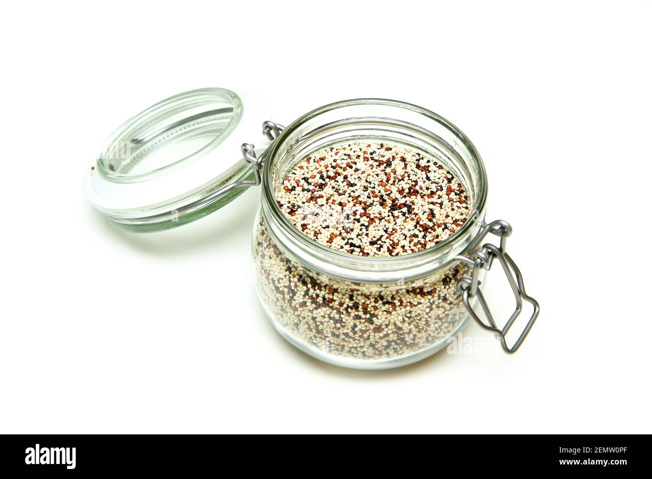 The wild quinoa stored inside the closable glass bottle isolated on a ...