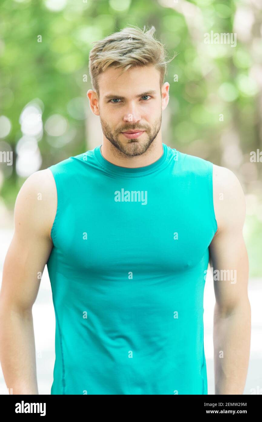 Proud to be strong. Man sporty outfit looks confident outdoors nature ...