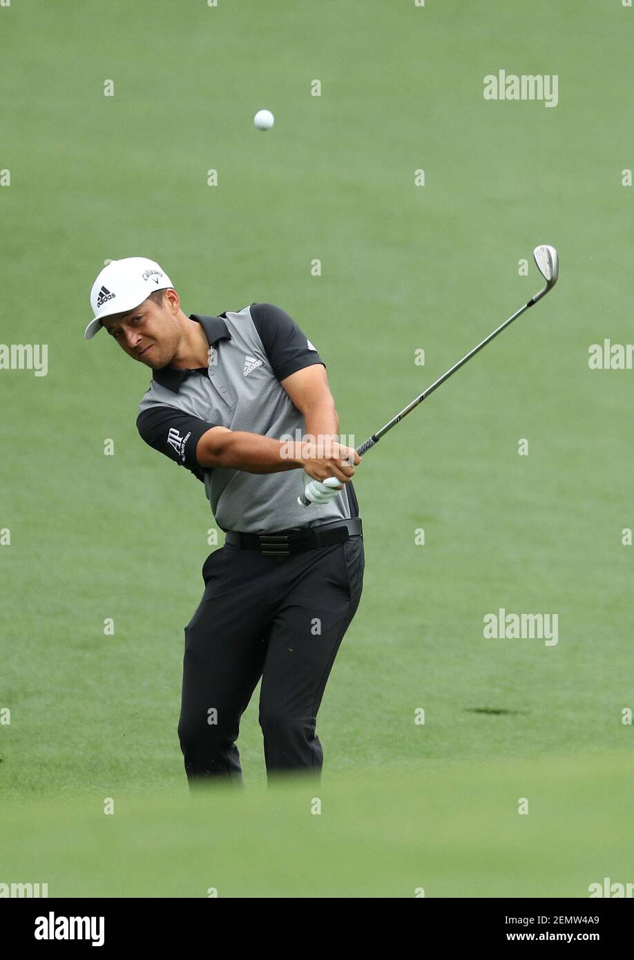 Xander Schauffele chips to the green on 2 during the final round of the ...