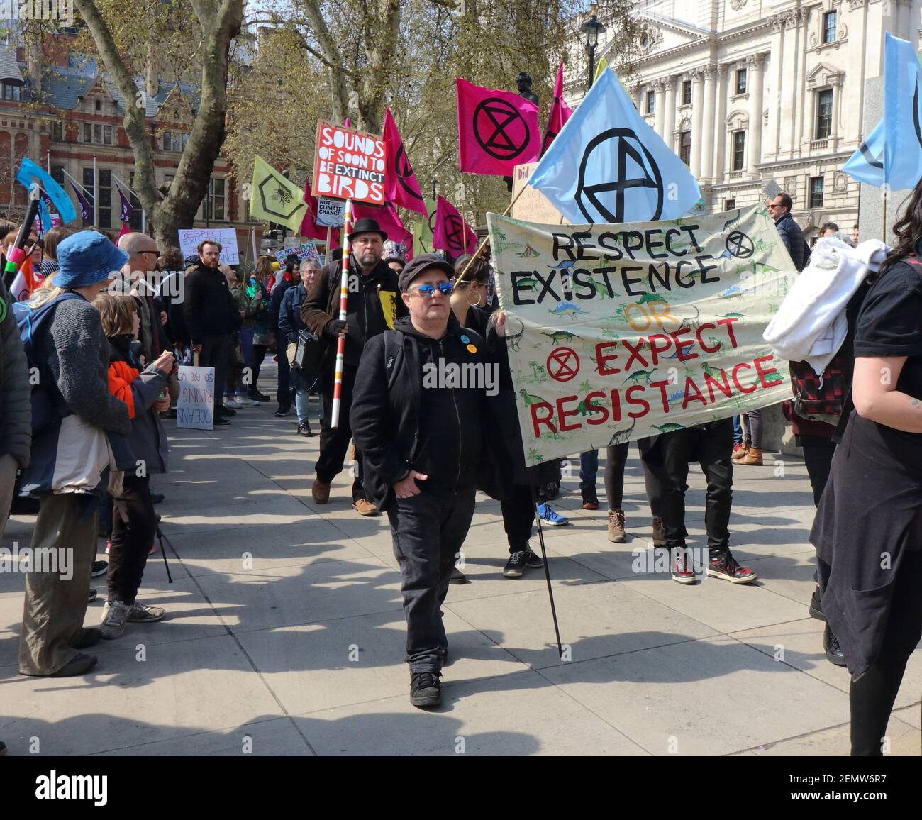 Protesters seen holding a banner during the Extinction Rebellion mock ...