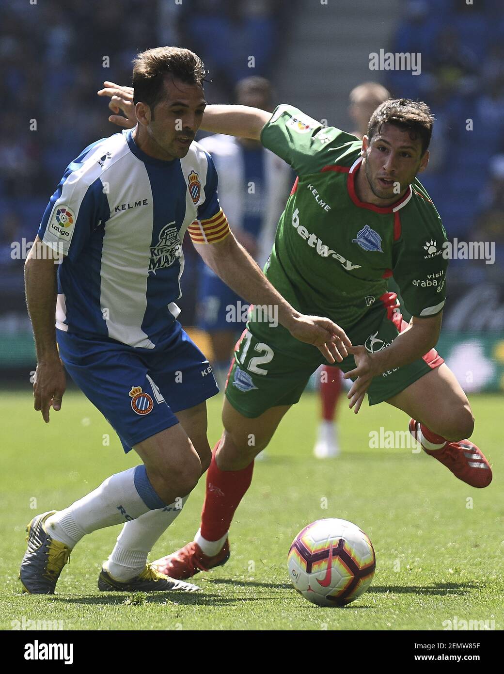 Victor Sanchez of RCD Espanyol and Jonathan Calleri of Deportivo Alaves ...